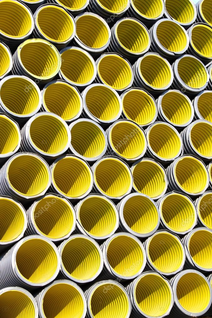 Many yellow corrugated pipes for laying electric cables and opti ...