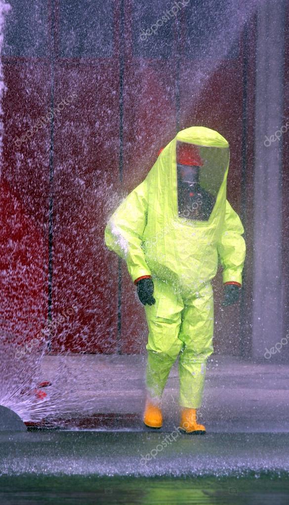 Firefighter protective yellow jumpsuit with for protection from — Stock ...