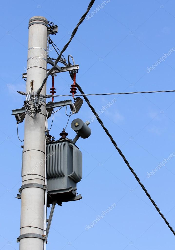 Electricity transformer with cables on a pylon — Stock Photo ...