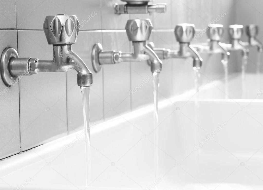Steel taps into a large bathroom in the community — Stock Photo ...