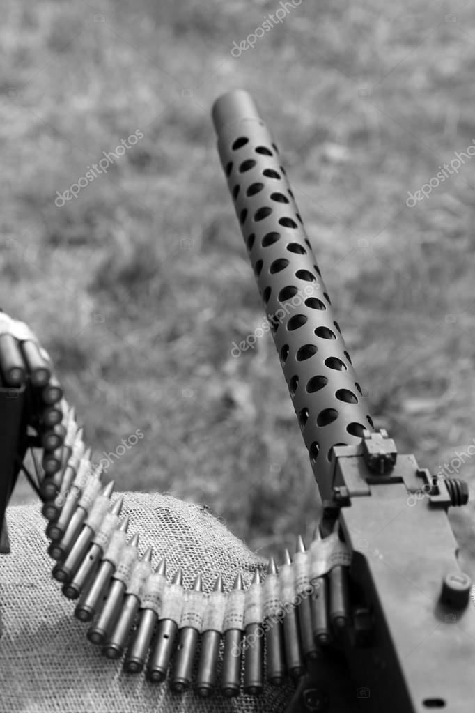 Big machine gun with bullets over the sandbags in a trench Stock Photo ...