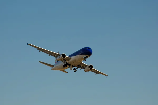 Airplane flying with blue sky in background Stock Photo by ©ImageSupply ...