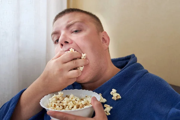 Fat man eating popcorn Stock Photos, Royalty Free Fat man eating ...