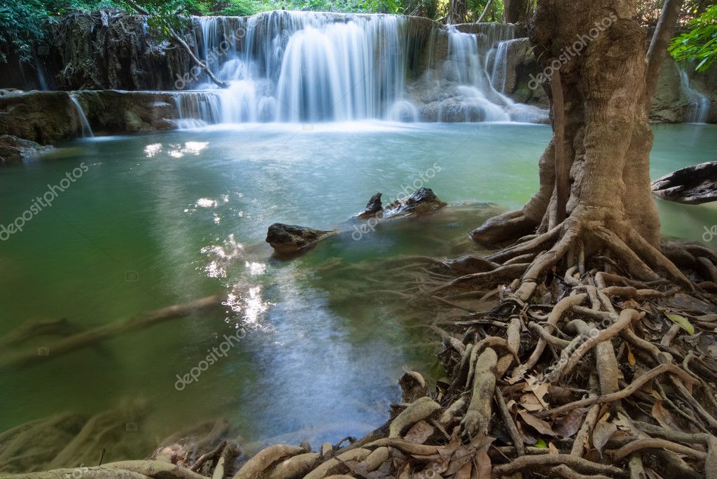 Waterfalls cascading off small cliffs — Stock Photo © gnomeandi #52290579