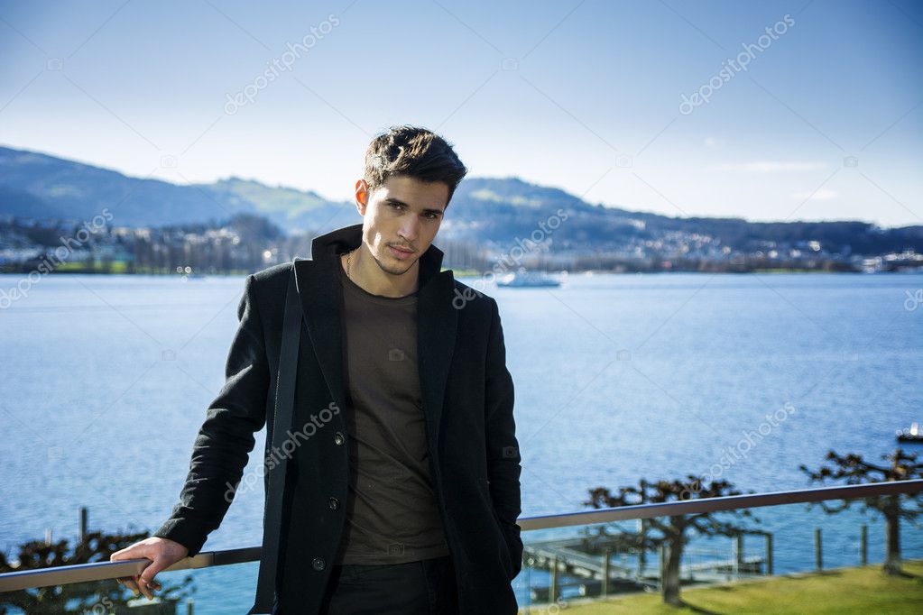 Handsome young man on Luzern lakes shore Stock Photo by ©artofphoto ...