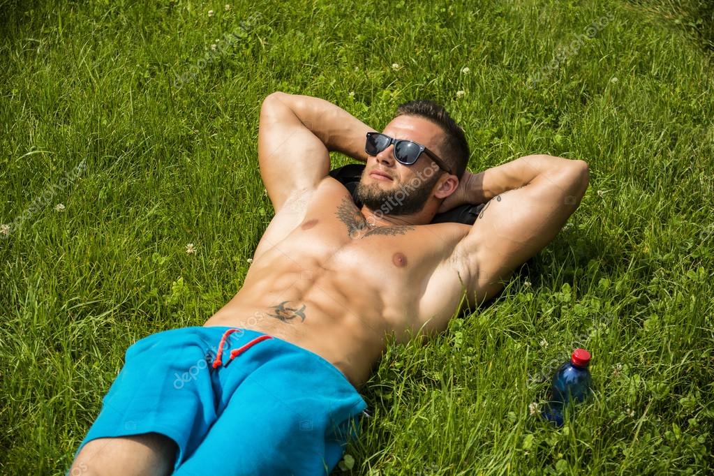 Handsome Muscular Shirtless Hunk Man Outdoor in City Park Stock Photo ... Handsome Muscular Shirtless Hunk Man Outdoor in City Park Stock Photo ...