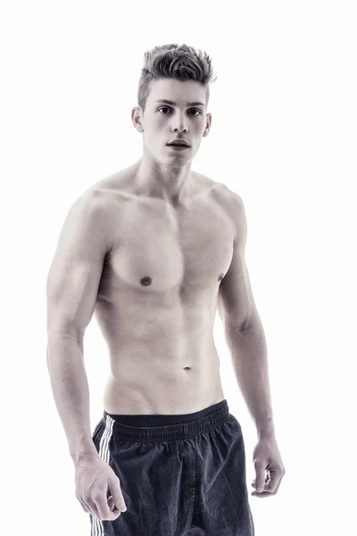 Handsome young bodybuilder in relaxed pose — Stock Photo © artofphoto ...