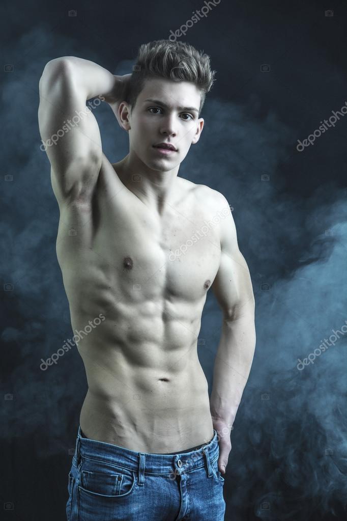 Handsome young bodybuilder in relaxed pose Stock Photo by ©artofphoto ...