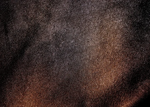 Luxurious dark brown gold leather texture. Small scrapes and folds ...