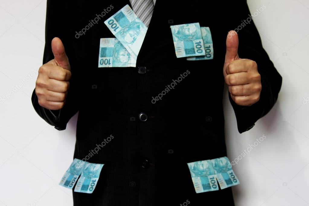 Man holding 100 real notes Stock Photo by ©joelfotos 123963136