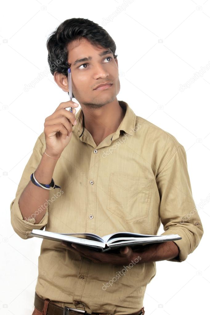 Beautiful Young Indian Boy thinking with Pen & Diary — Stock Photo ...