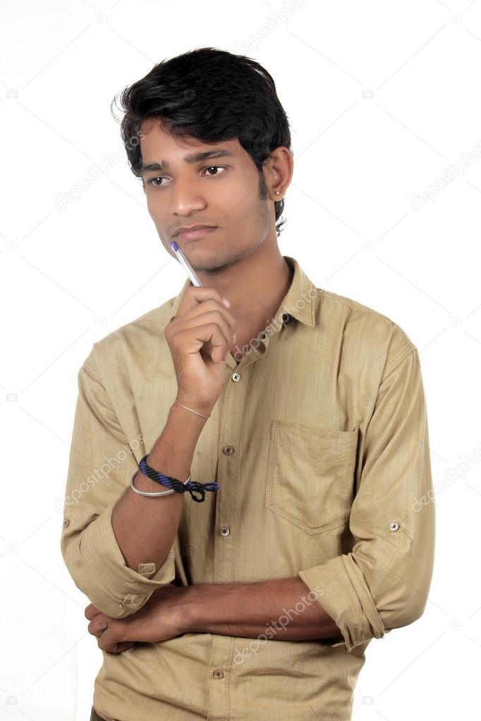 Beautiful Young Indian Boy thinking with pen — Stock Photo ...