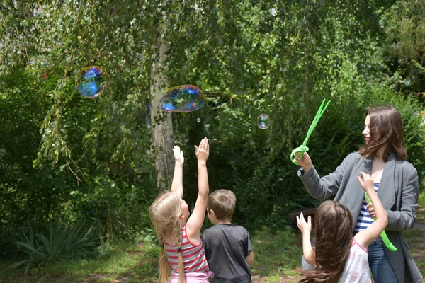Children Playing Blowing Bubbles Park: fotografía de stock © GalinkaLB ...