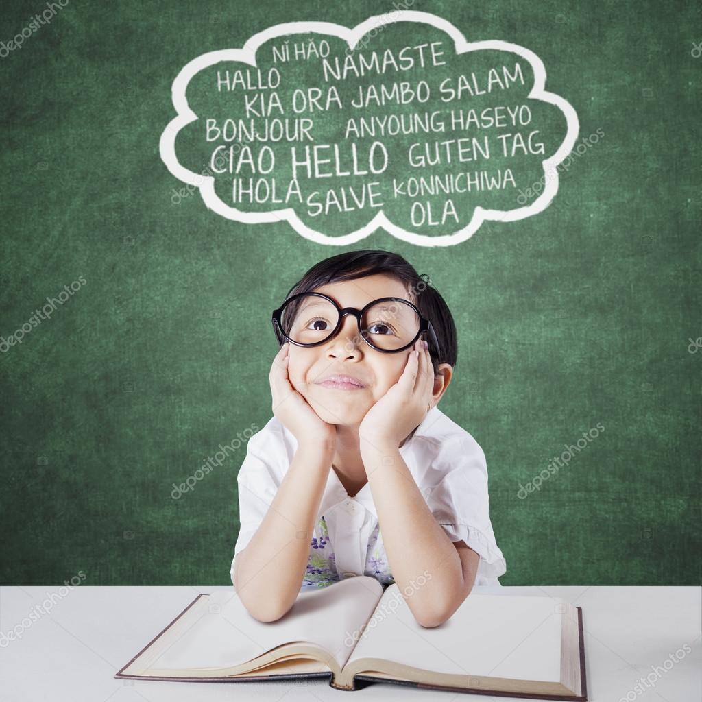 Kid studying multi language with a textbook — Stock Photo ...