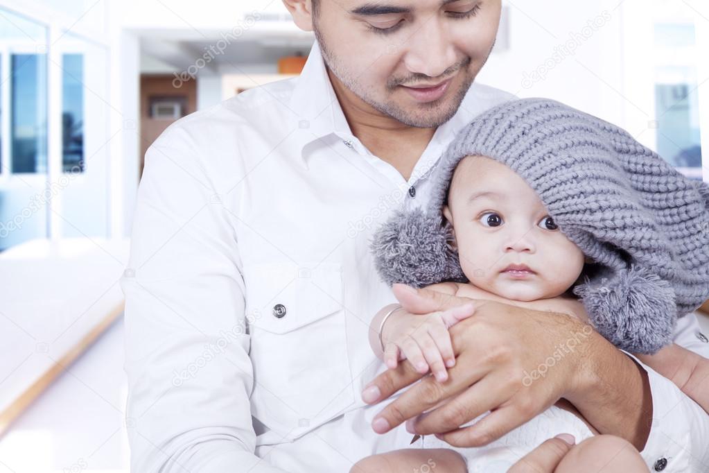 Young father take care his baby Stock Photo by ©realinemedia 103490544