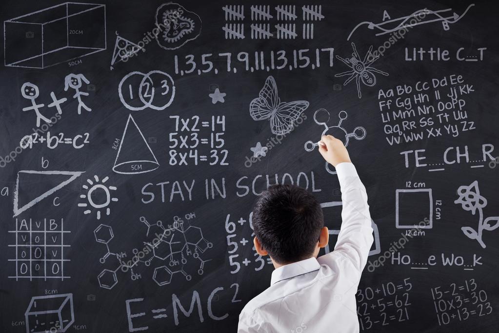 Schoolboy writing doodles on chalkboard Stock Photo by ©realinemedia ...
