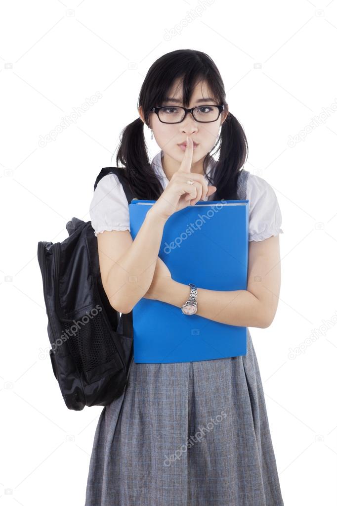 College student makes silence sign Stock Photo by ©realinemedia 119923768