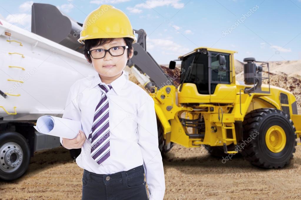 Little engineer and loader machine Stock Photo by ©realinemedia 123976430
