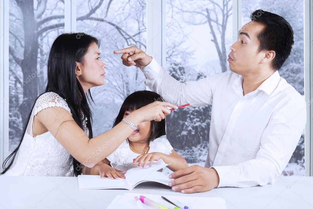 Parent arguing in front of daughter Stock Photo by ©realinemedia 123976890
