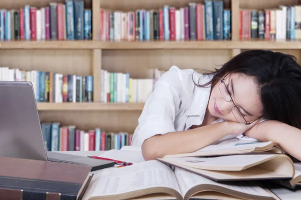 Female student sleeping over books - Stock Image - Everypixel