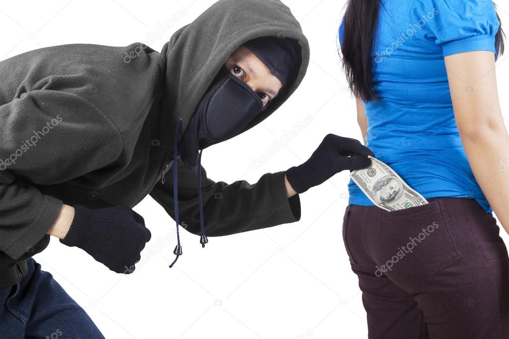 Pickpocket in action to take money — Stock Photo © realinemedia #74069615