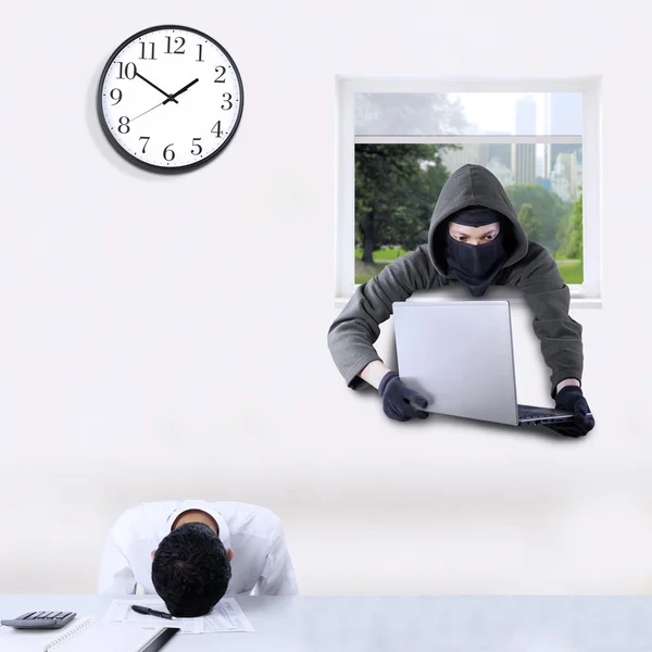Thief stealing document in office Stock Photo by ©realinemedia 64280943