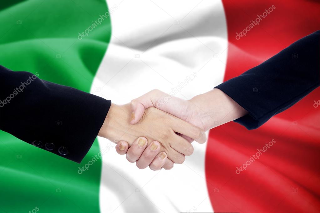 Handshake with an italy flag background Stock Photo by ©realinemedia ...