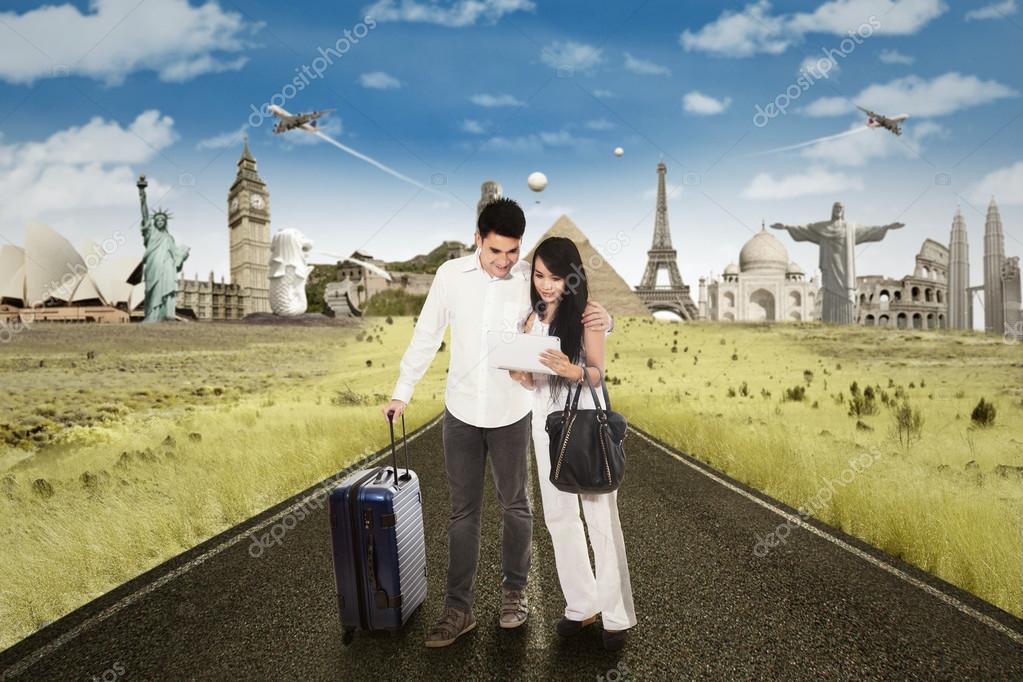 Travelers looking map on the road with tablet — Stock Photo ...