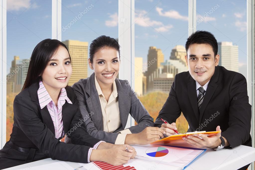 Group of three workers meeting in office Stock Photo by ©realinemedia ...