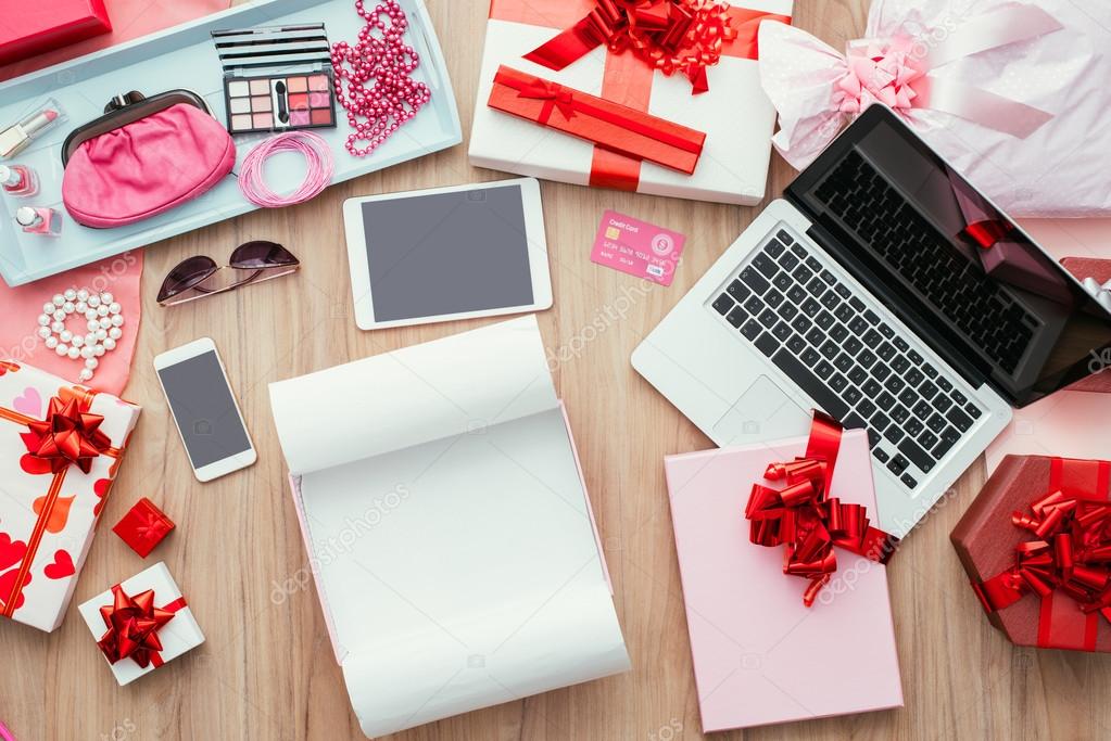 Gift boxes on a desktop with a laptop, Stock Photo by ©stokkete 119974052
