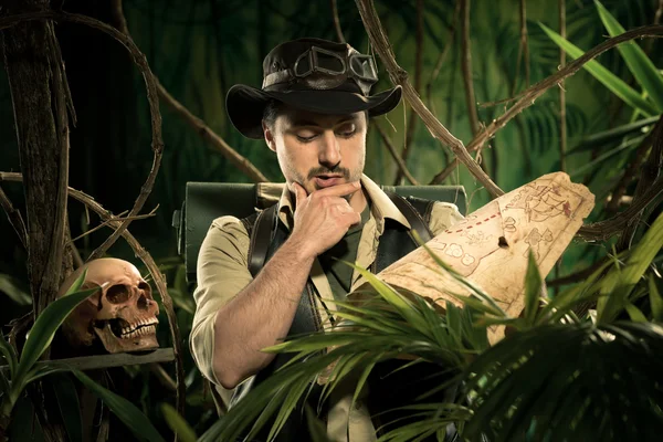 Explorer finding a treasure Stock Photo by ©stokkete 51830007