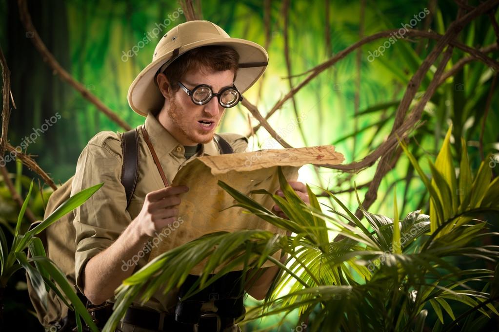 Lost explorer with old map Stock Photo by ©stokkete 51829795