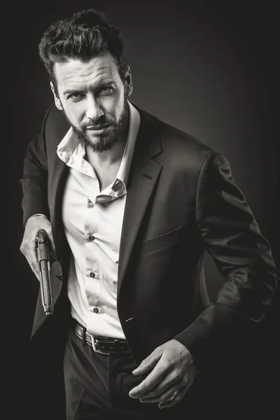 ᐈ Handsome man with gun stock photos, Royalty Free handsome man gun ...