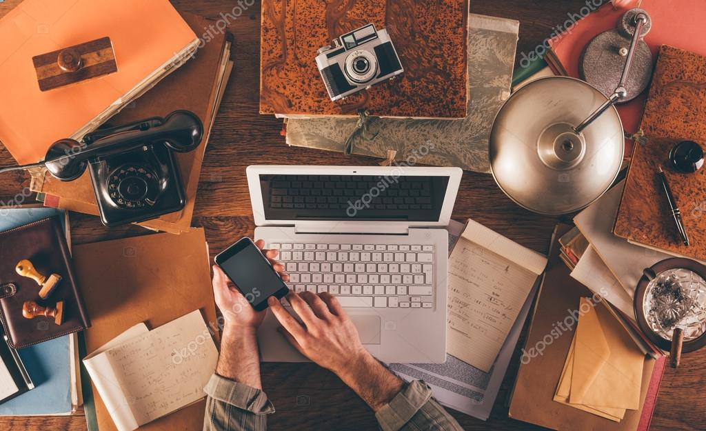 Messy vintage desktop with laptop — Stock Photo © stokkete #82879618