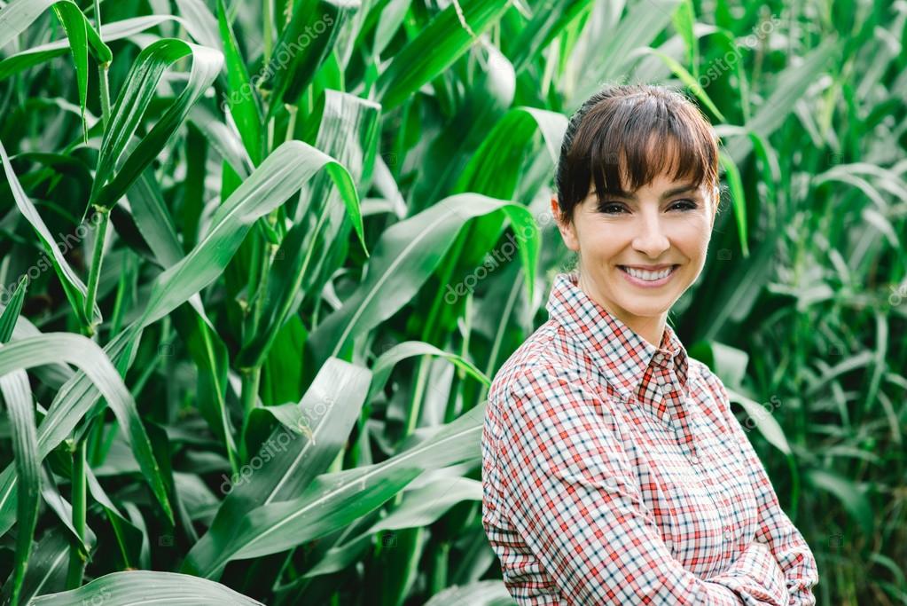 Farmer posing in the corn field — Stock Photo © stokkete #88246594