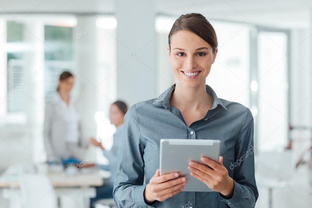 Woman using a touch screen tablet — Stock Photo © stokkete #88252164