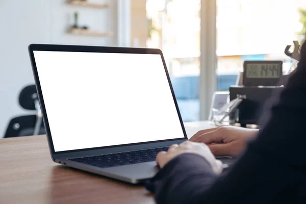 Mockup image of hands using and typing on laptop with blank white ...