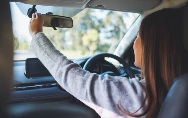 Woman Adjusting Rear View Mirror While Driving Car — Stock Photo ...
