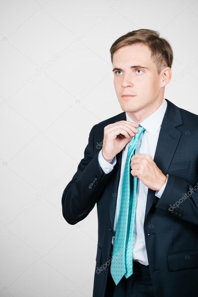 Fixing a tie. Stock Photo by ©mskalinin 86572796