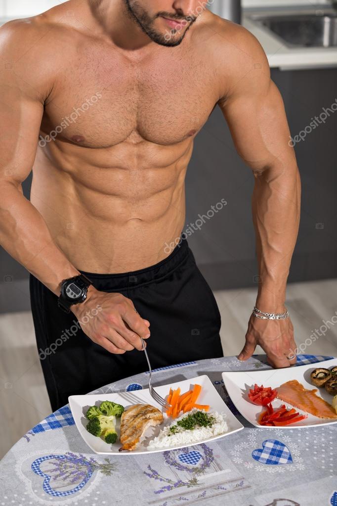 Young bodybuilder in the kitchen Stock Photo by ©fotomircea 106707204