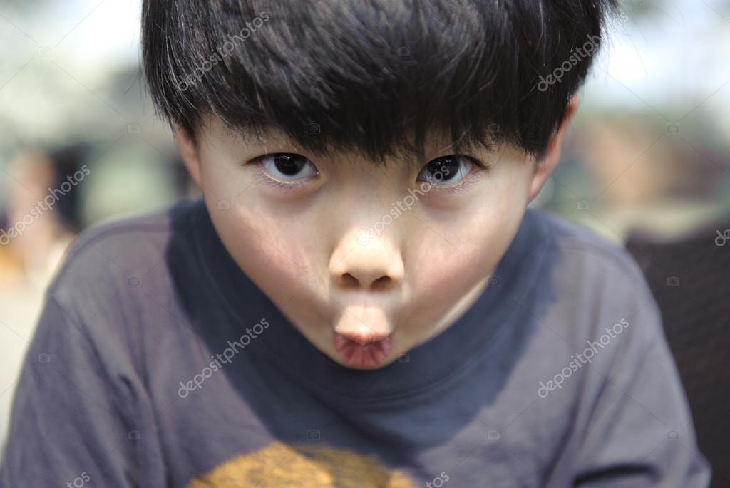 Boy to make exaggerated facial expressions — Stock Photo © jackq #112520236