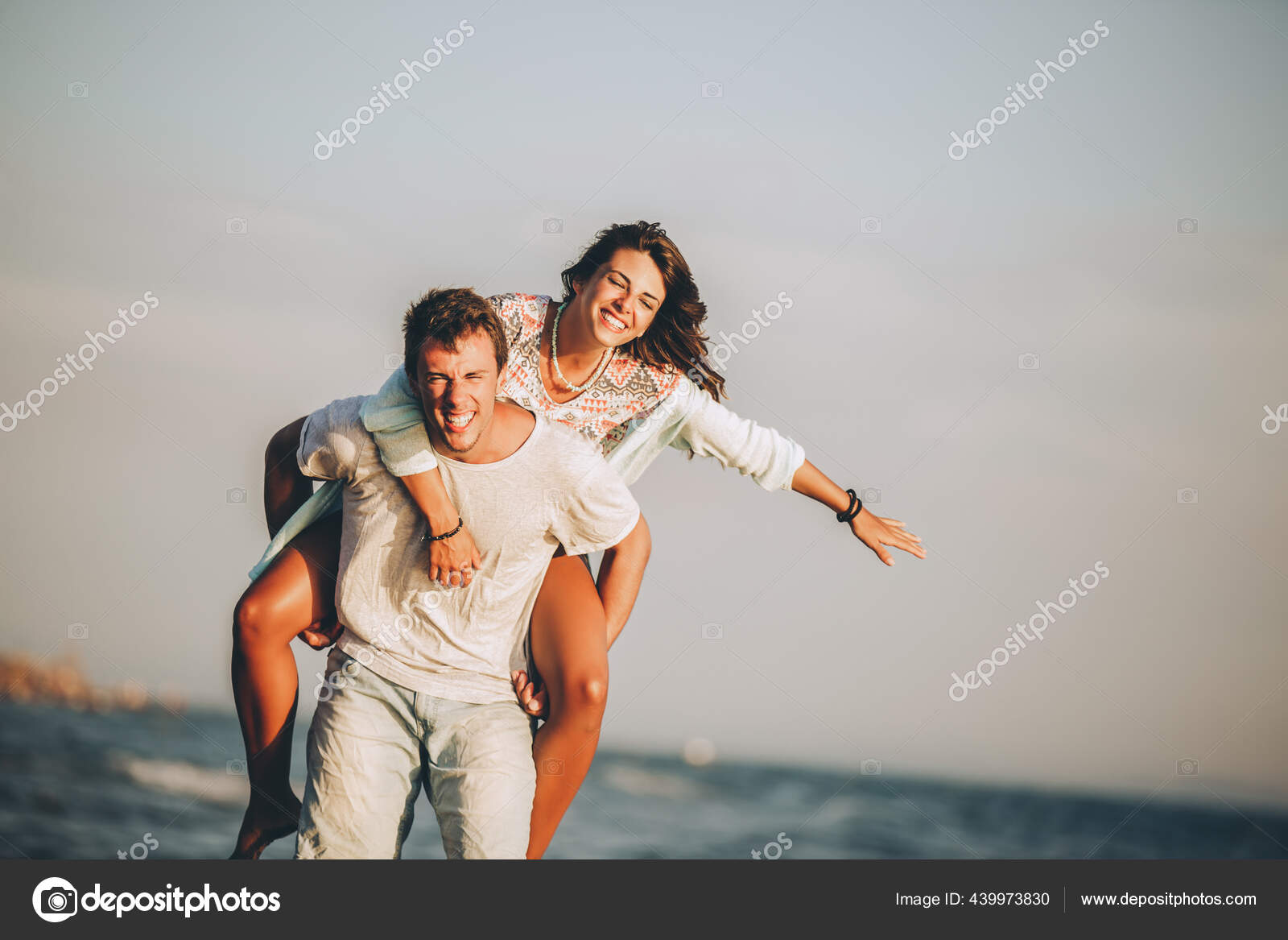 Young Man Giving Piggyback Ride Girlfriend Beach Stock Photo by ...