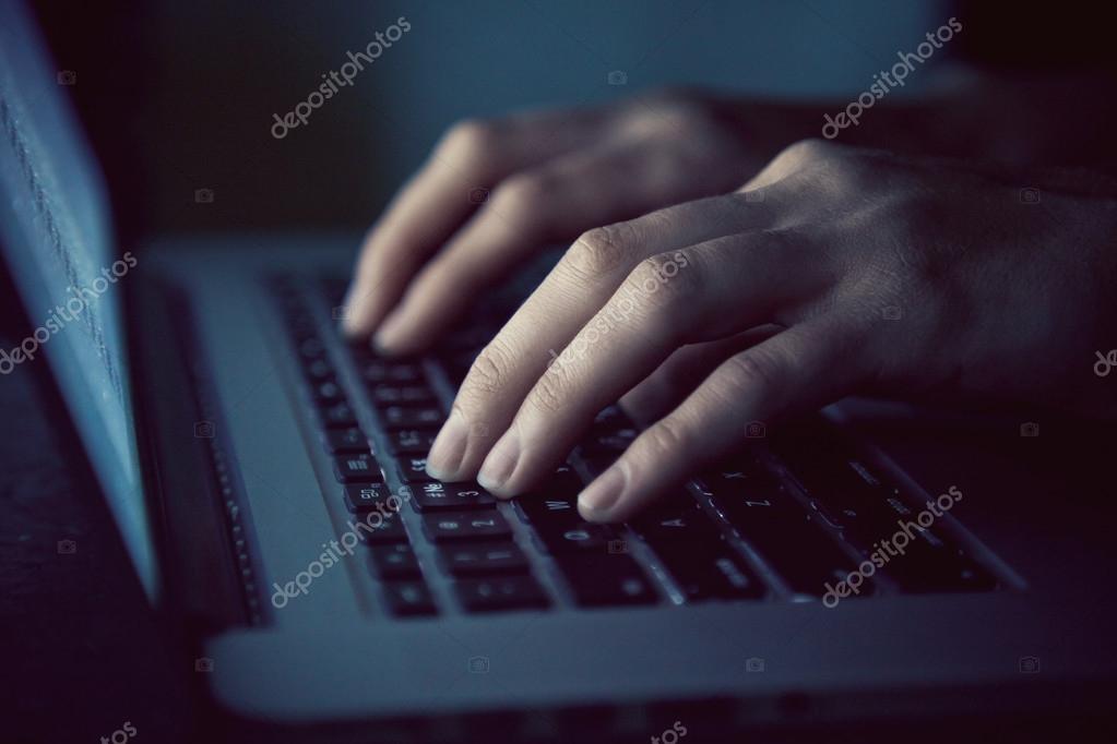 Hands with laptop typing in night Stock Photo by ©dedivan1923 79574816