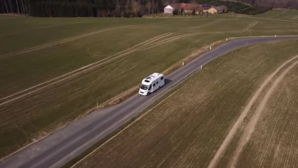 Tracking Shot of a Traveling White Camper Van Taken With a Flying Drone ...