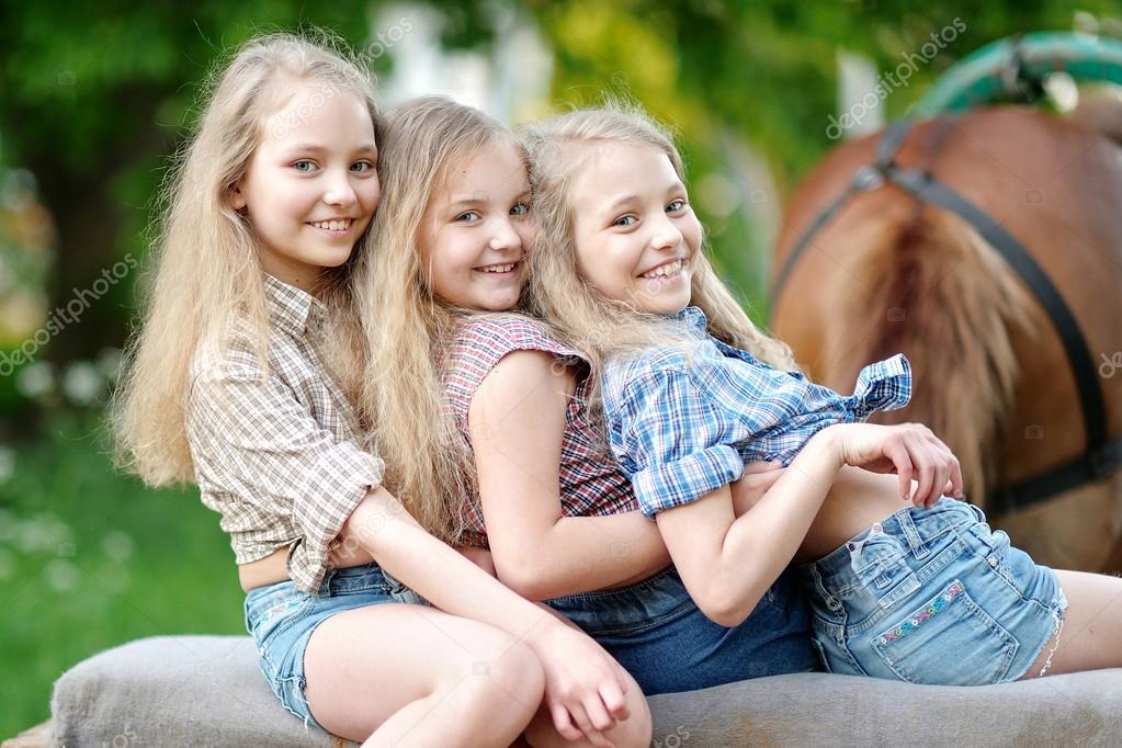 Portrait of three girlfriends on the nature — Stock Photo © zagorodnaya ...