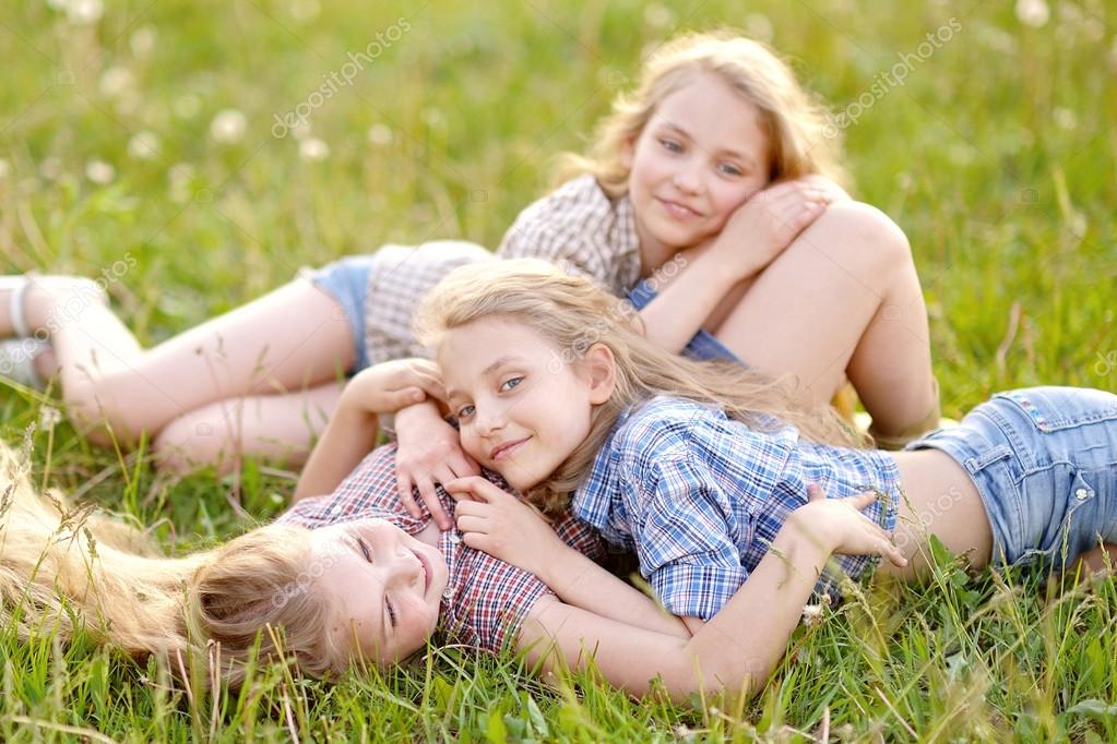 Portrait of three girlfriends on the nature Stock Photo by ©zagorodnaya ...
