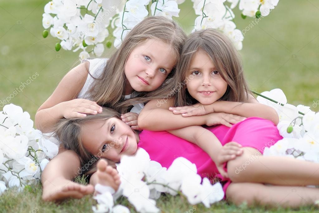 Portrait of three girlfriends on the nature — Stock Photo © zagorodnaya ...