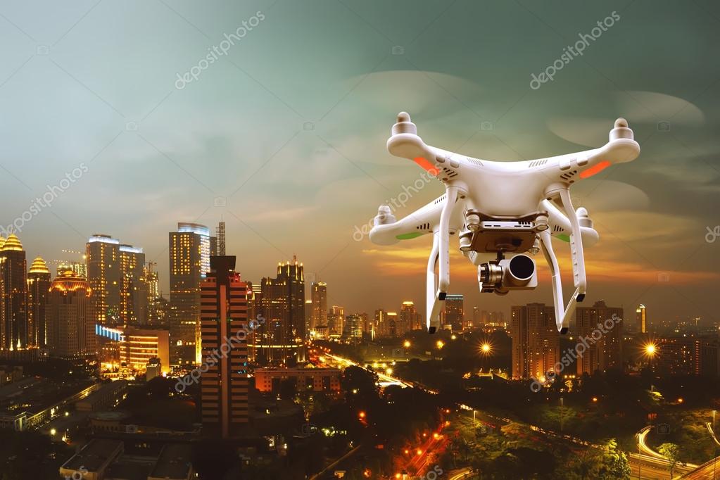Drone flying over the city Stock Photo by ©leolintang 101885138