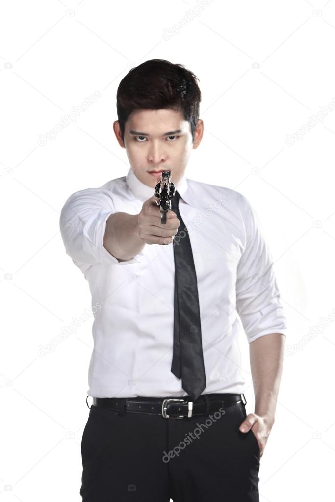 Srcret agent holding a gun Stock Photo by ©leolintang 92841484