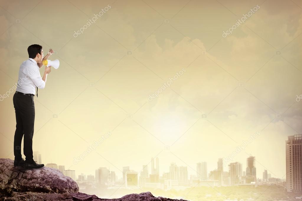 Man yelling using megaphone — Stock Photo © leolintang #94520668